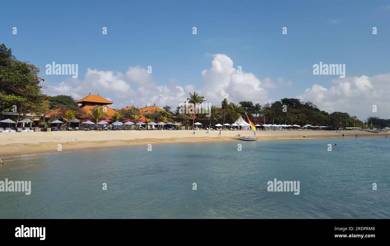 Sunset or sunrise on the beach in Bali in Sanur. beautiful temples in ...