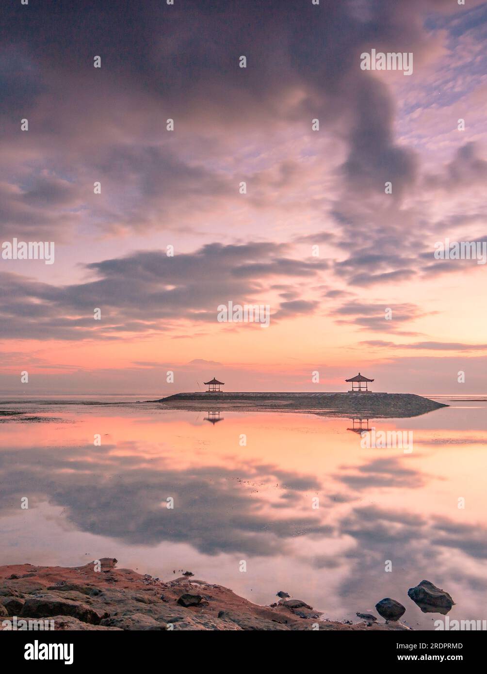 Sunset or sunrise on the beach in Bali in Sanur. beautiful temples in ...