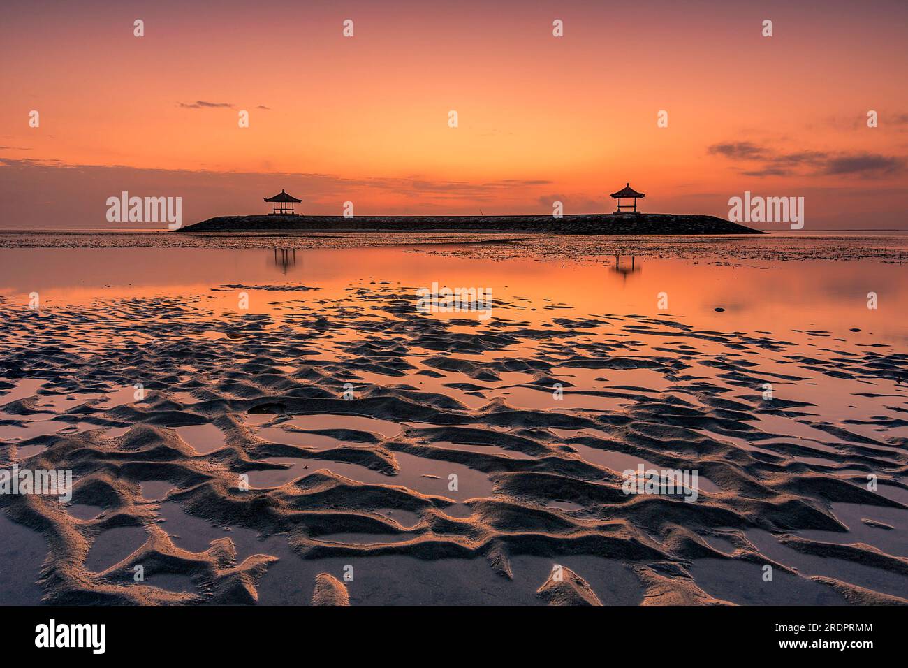 Sunset or sunrise on the beach in Bali in Sanur. beautiful temples in ...