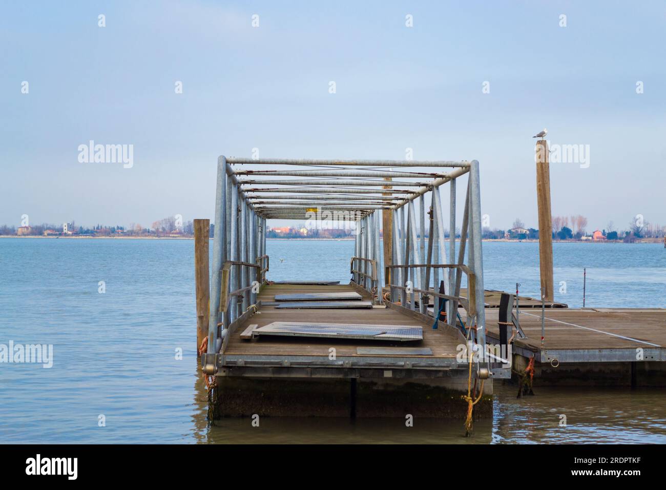 Wooden pier of Punta Sabbioni- a port for daily boats to Venice.Punta ...