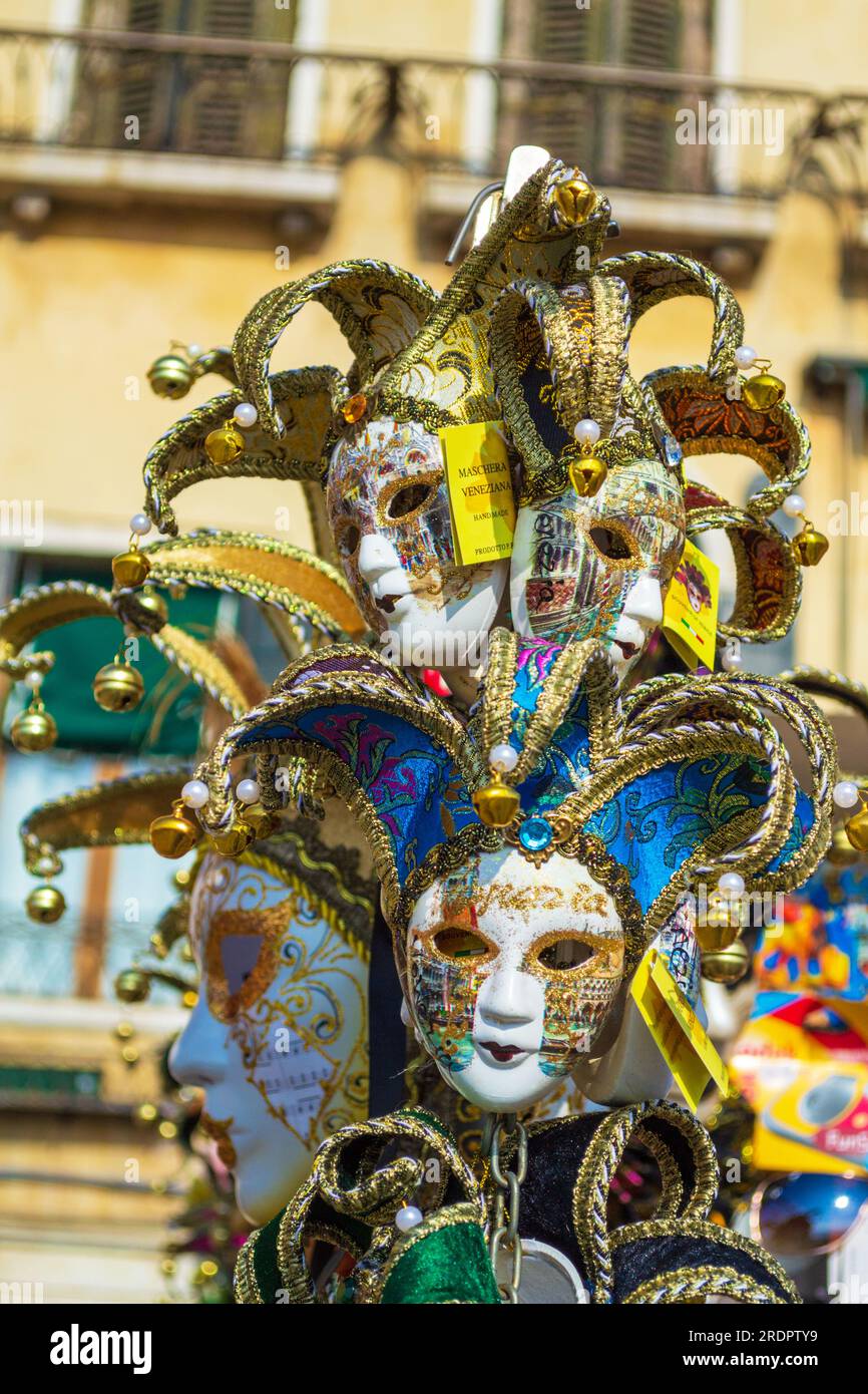 :Beautiful carnival masks in variety of colours displayed on vendor ...