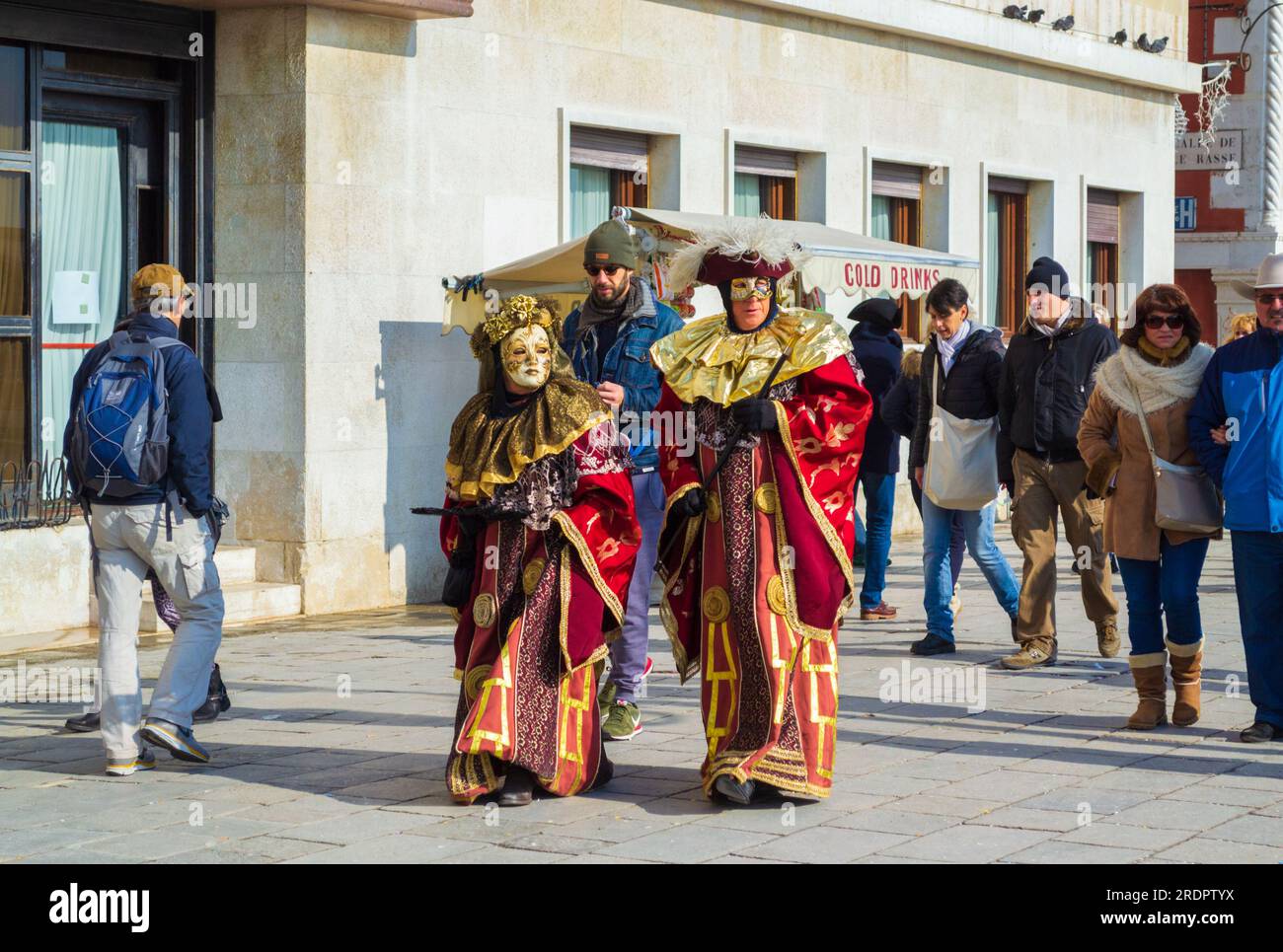 Spectacular costumes of disguised people and tourists having fun at ...
