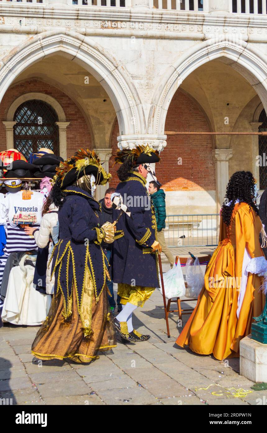 Spectacular costumes of disguised people and tourists having fun at ...