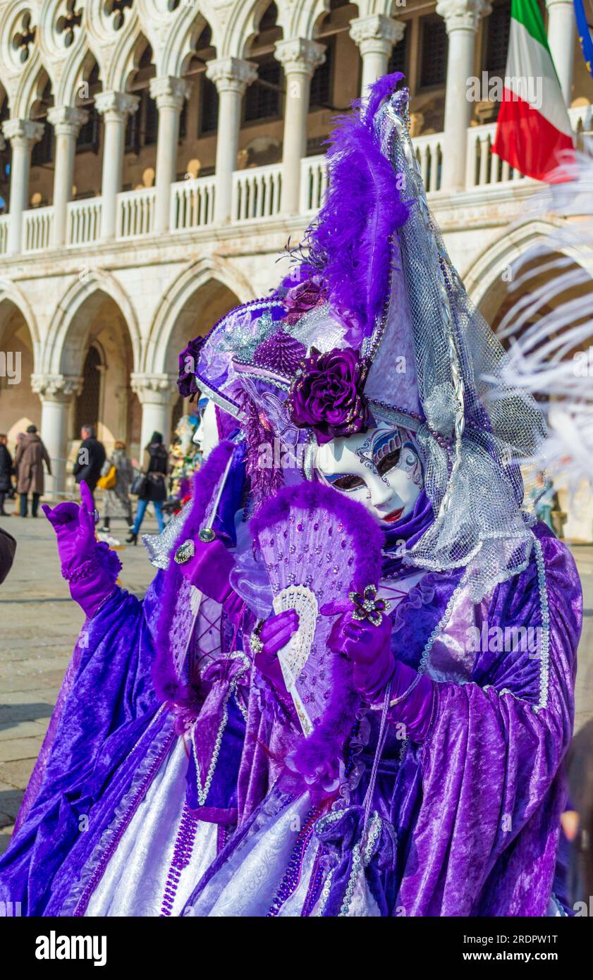 Spectacular costumes of disguised people and tourists having fun at ...