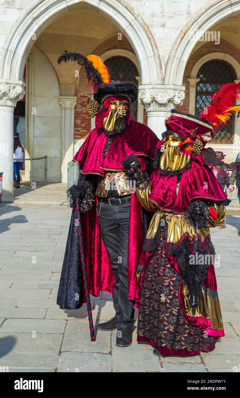 Spectacular costumes of disguised people and tourists having fun at ...