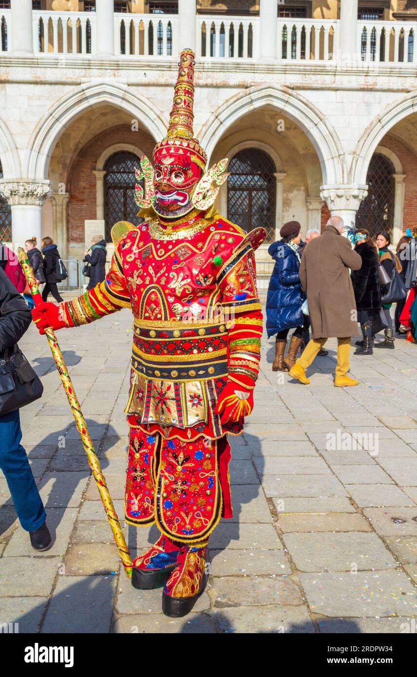 Spectacular costumes of disguised people and tourists having fun at ...