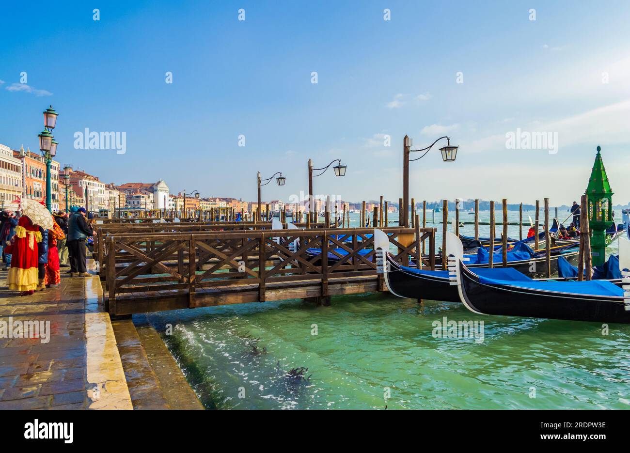 Early morning view of Venice waterfront with gondolas waiting to be ...