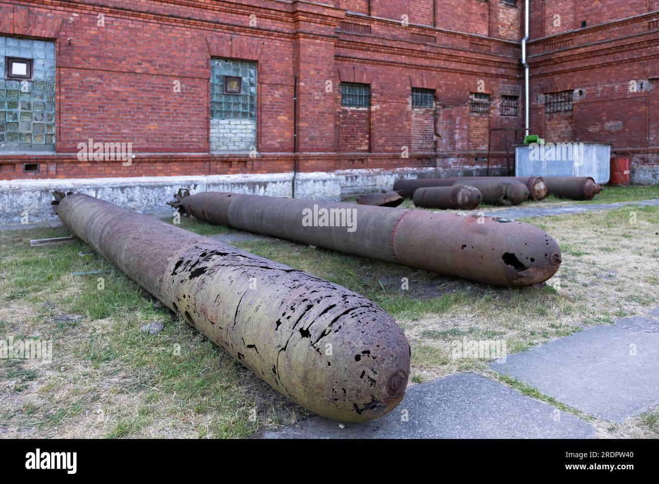 Old derelict torpedoes or bombs lie in front of the Karosta Prison ...