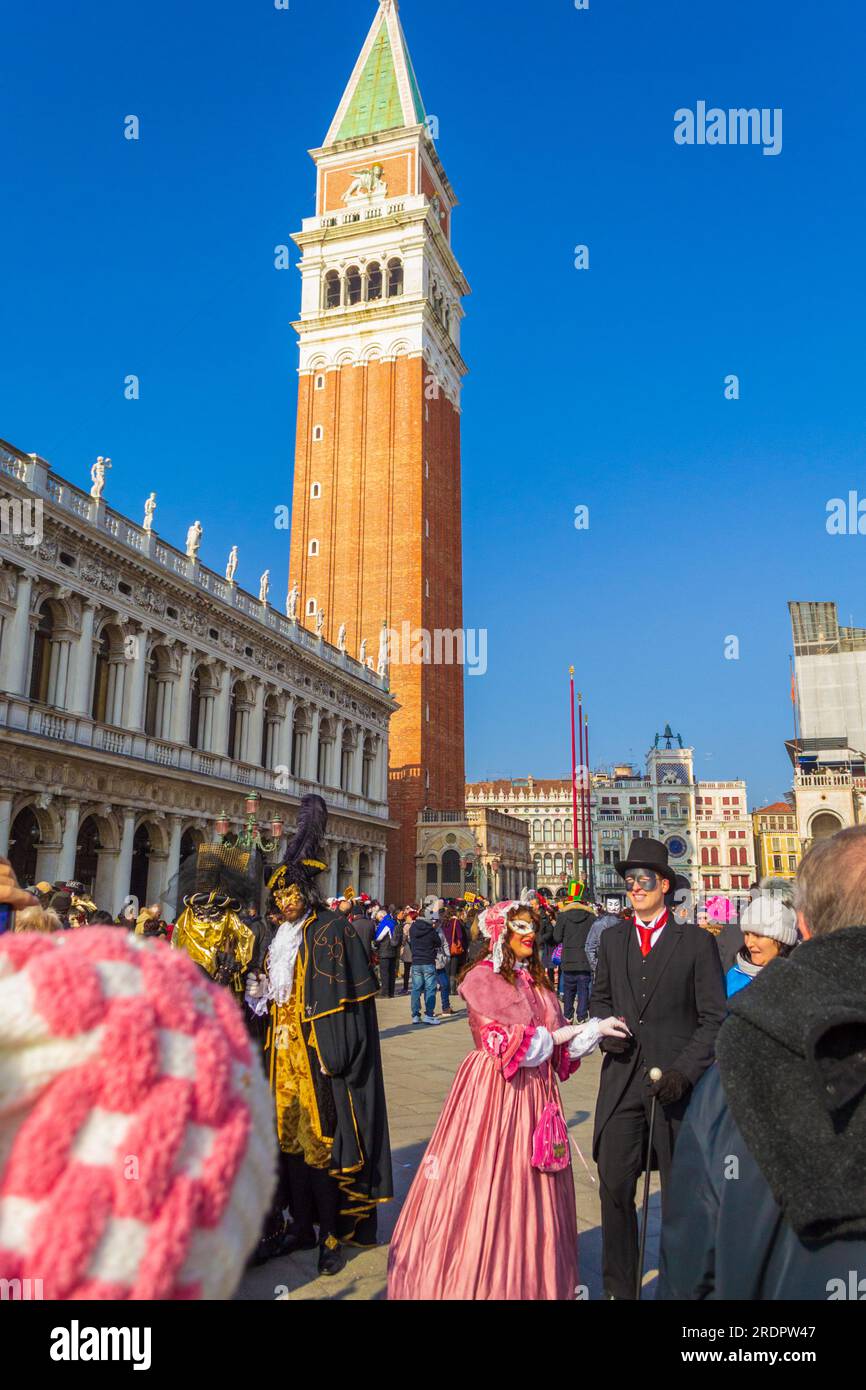 Spectacular costumes of disguised people and tourists having fun at ...