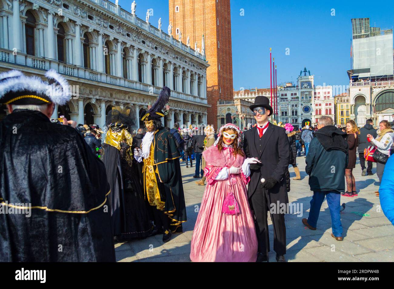 Spectacular costumes of disguised people and tourists having fun at ...