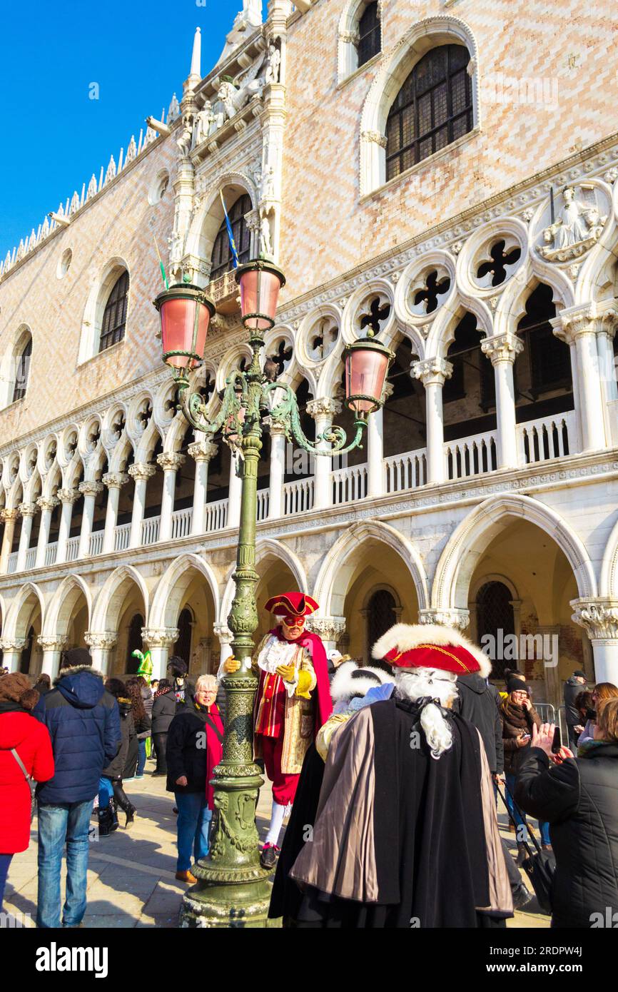 Spectacular costumes of disguised people and tourists having fun at ...