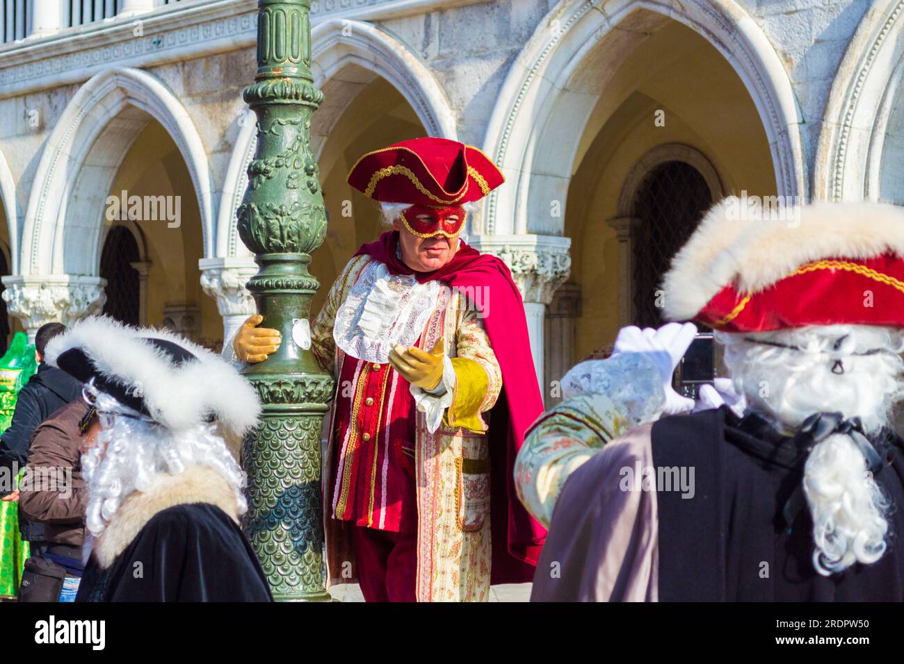 Spectacular costumes of disguised people and tourists having fun at ...