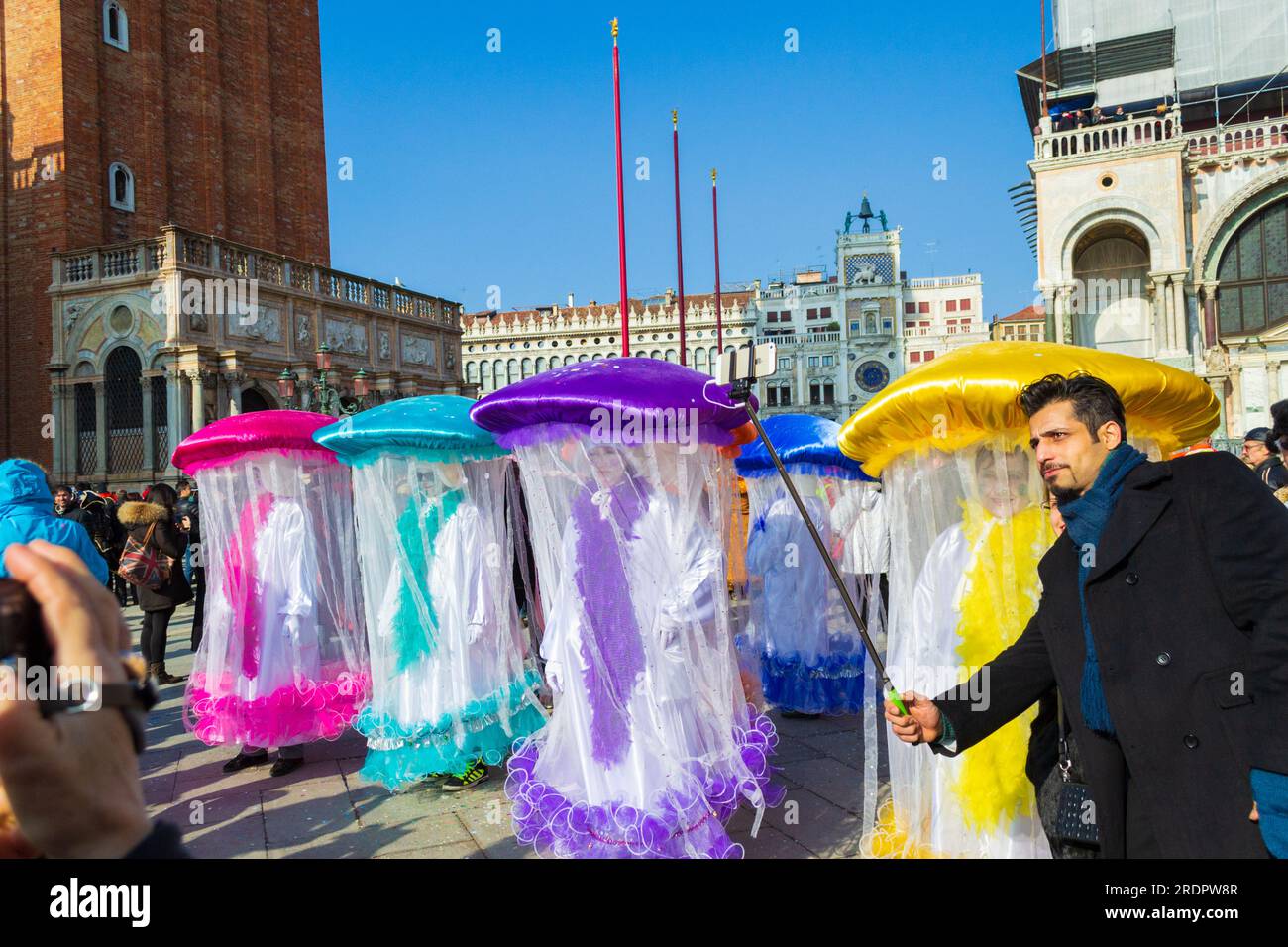 Spectacular costumes of disguised people and tourists having fun at ...