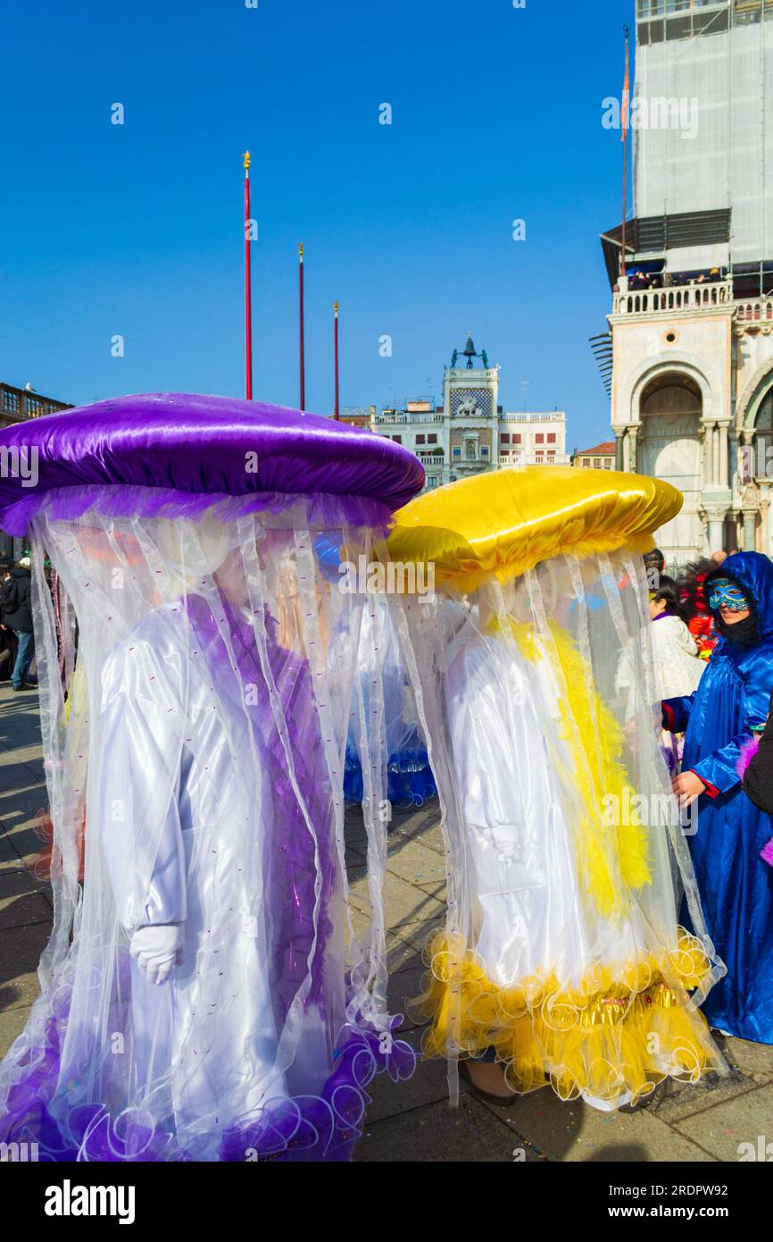 Spectacular costumes of disguised people and tourists having fun at ...