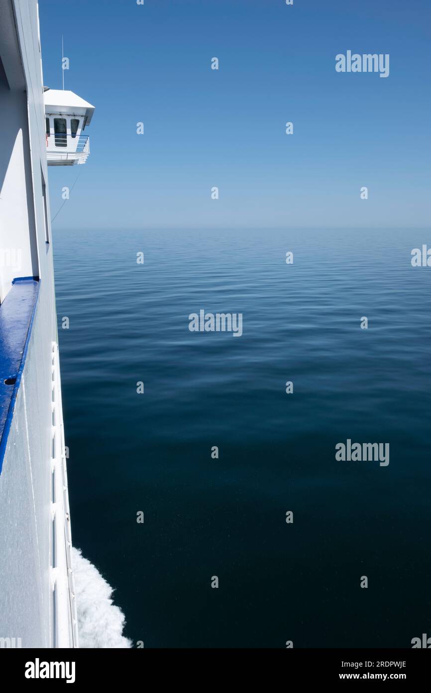 Wheelhouse or Bridge of a ship, viewed from the side. Quiet calm blue ...