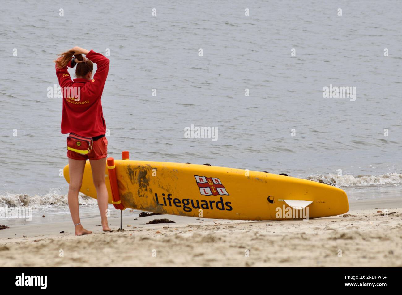 Lifeguard and Backboard on Sandy Beach Lyme Bay Lyme Regis Dorset ...