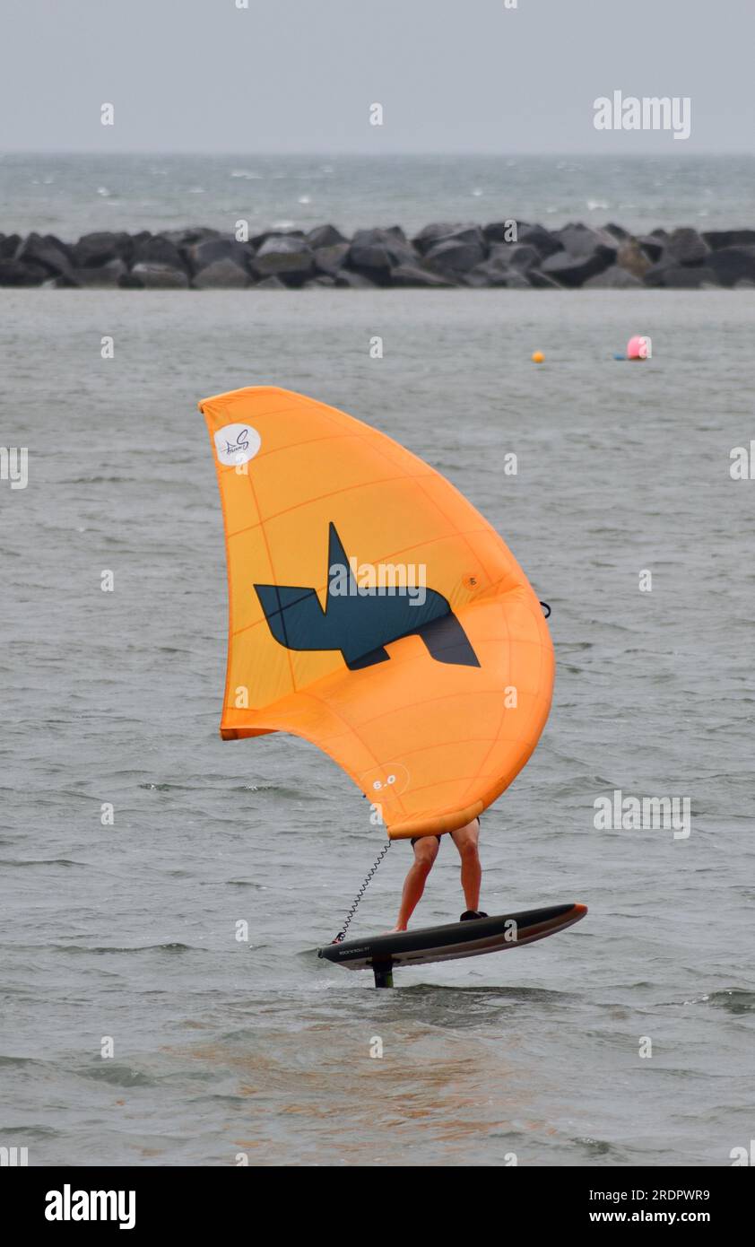 Wind Foiling in Action at Lyme Bay Lyme Regis Dorset England uk Stock ...