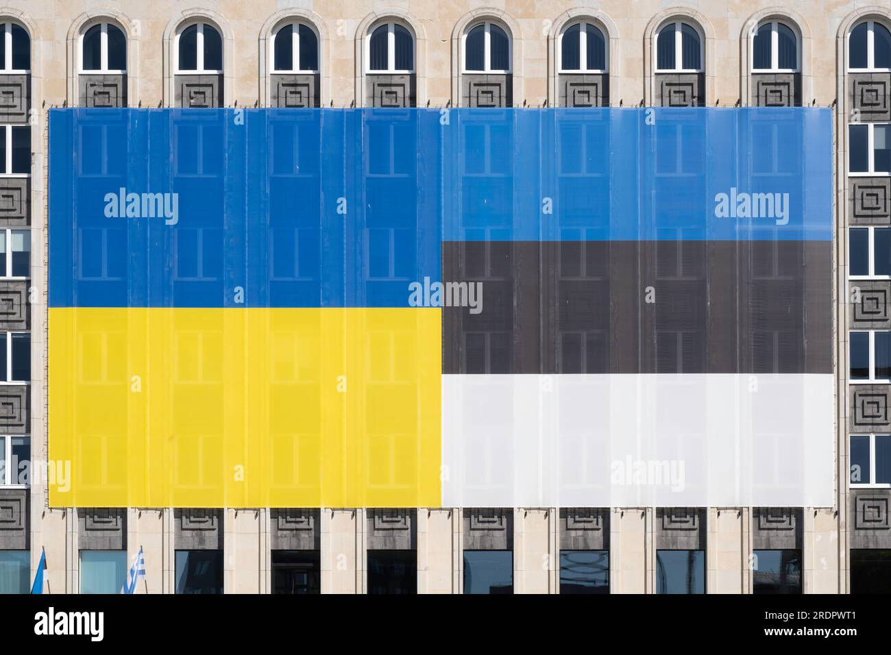 Huge yellow blue flag of Ukraine on the facade of a building on the ...
