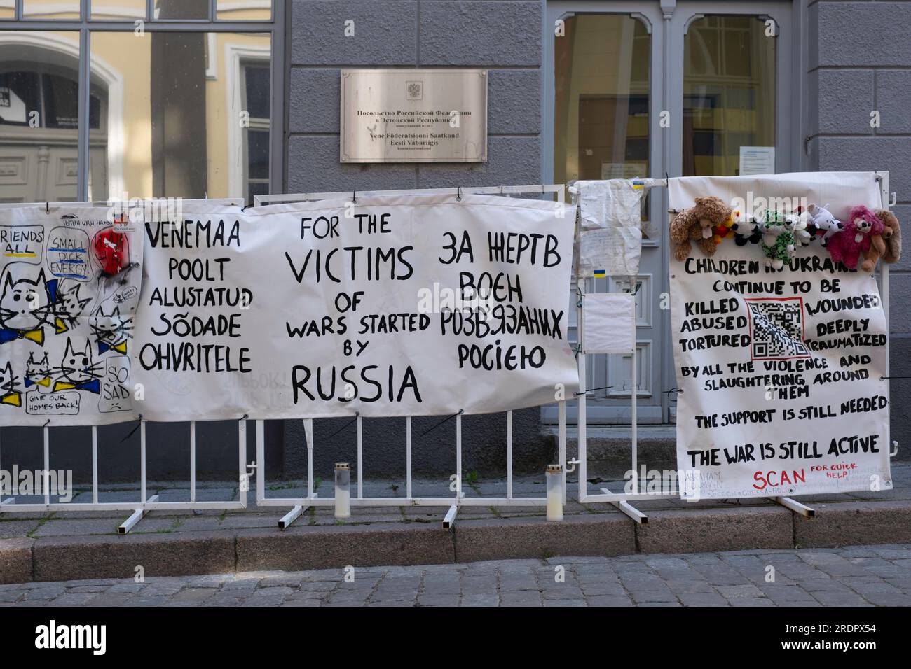 Protests in a street of the Russian embassy in Tallinn. Banners and ...