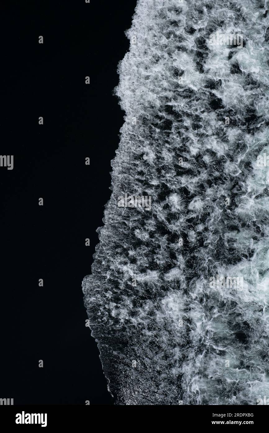 Bow waves of a ship with foam on the water of the sea. Splashing water ...