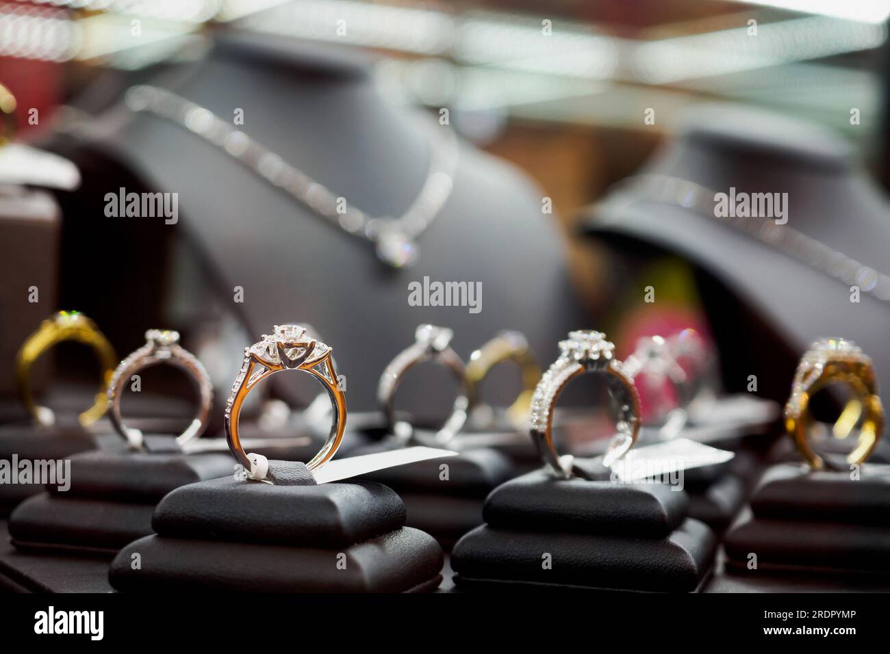 Jewelry diamond rings and necklaces show in luxury retail store window ...