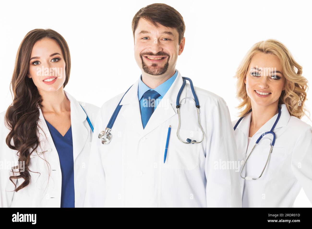 A medical team of doctors, man and women, isolated on white background ...