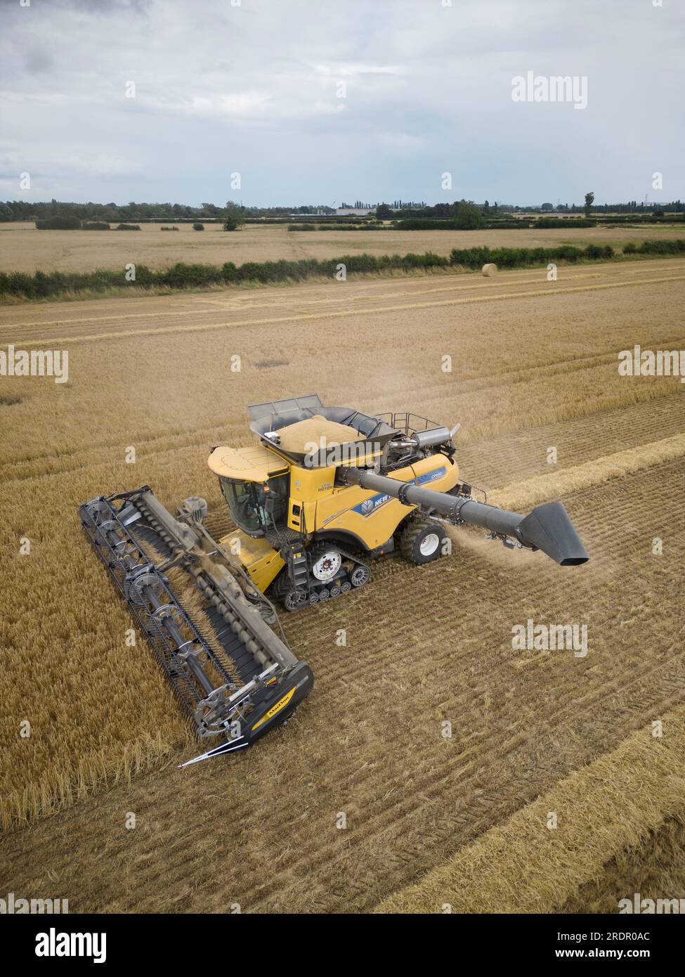 21st July 2023 New Holland CR990 fitted with a MacDon header harvesting ...