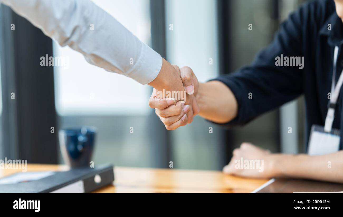 Business man and woman handshaking partner business handshake agreement ...