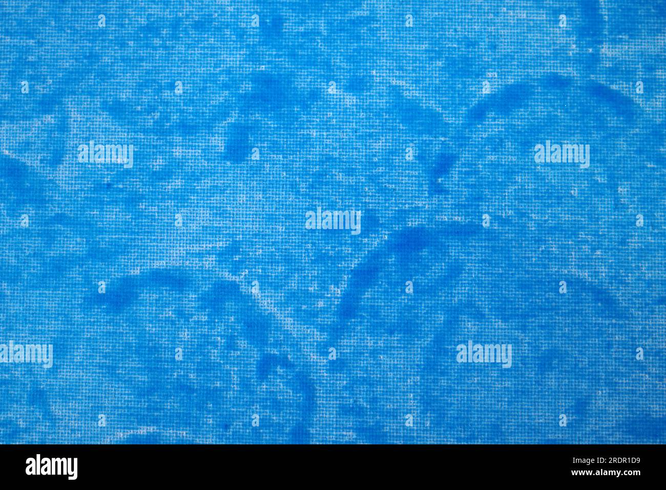 Canvas painted blue with a round sponge. Blue background with textile ...