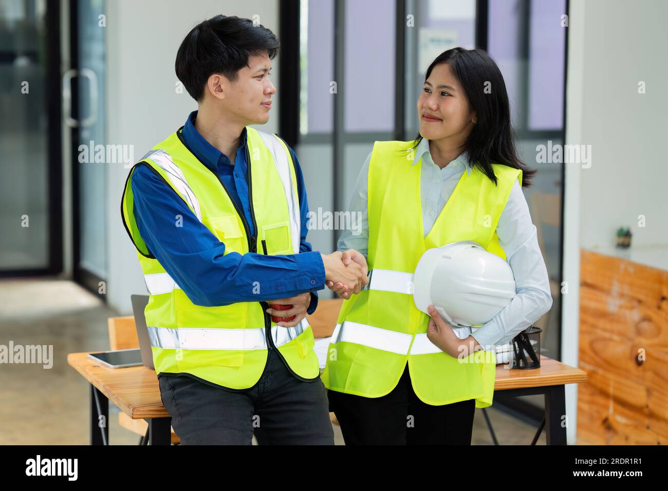 Civil engineers and architects handshake after work done at the office ...