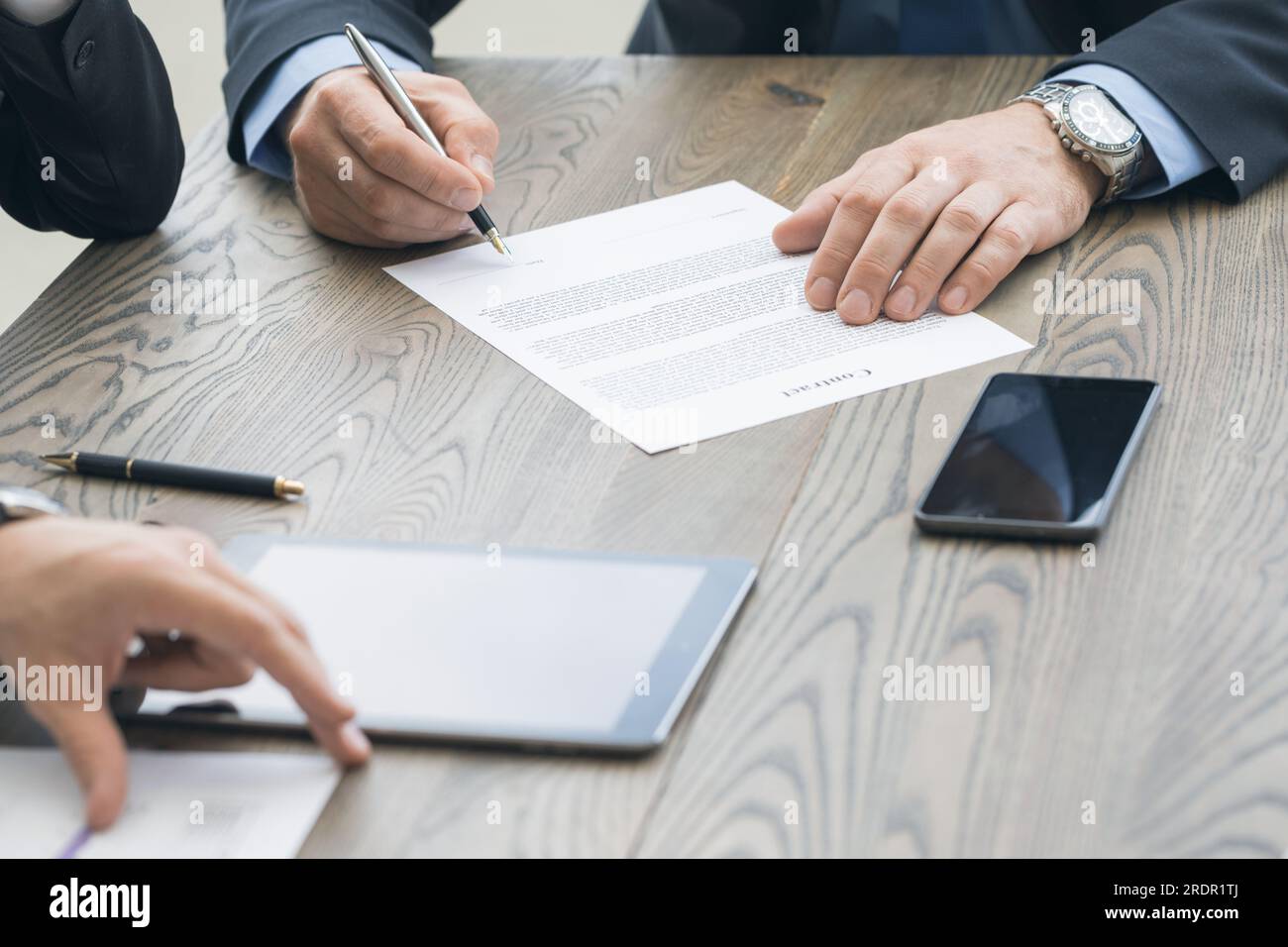 Business man sign contract on the desk at meeting Stock Photo - Alamy