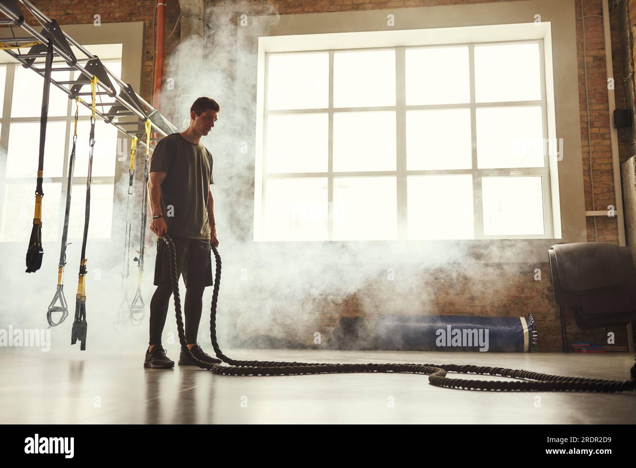 Never stop. Side view of young athletic man with perfect body doing ...