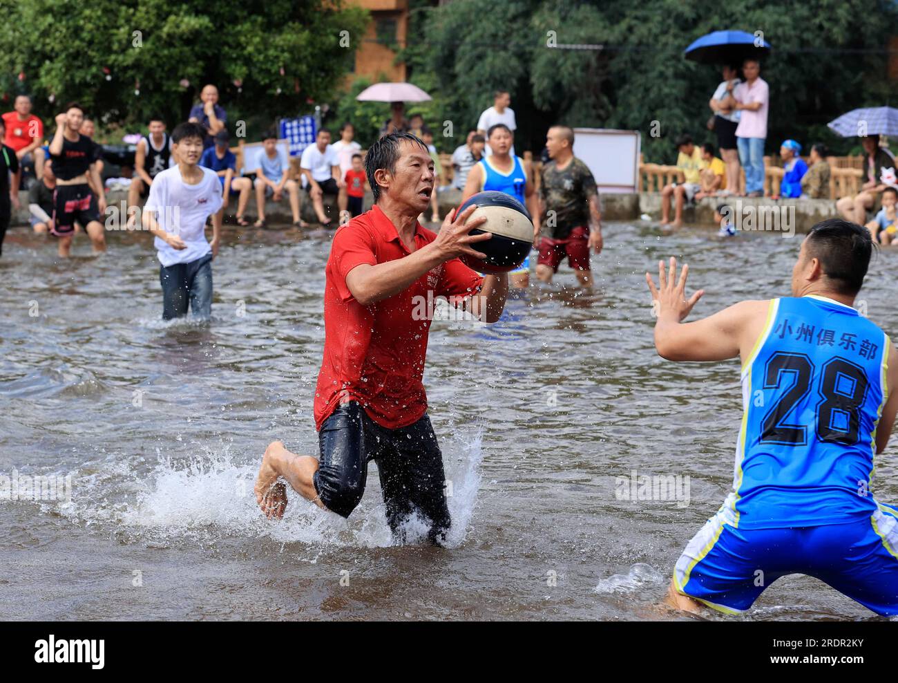 LIUZHOU, CHINA - JULY 23, 2023 - People compete in a water basketball ...