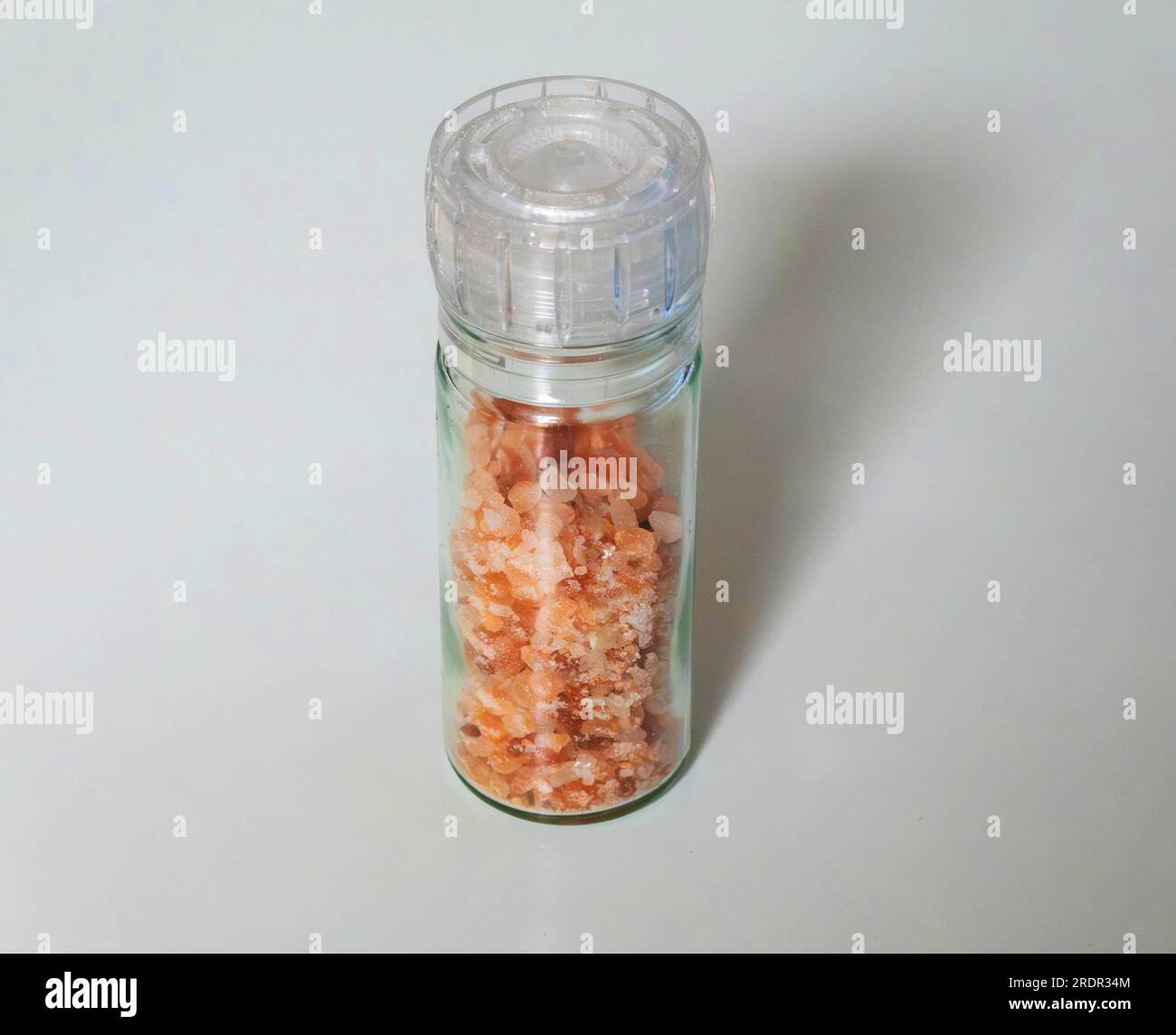Himalayan rose pink coarse salt in a grinder mill Stock Photo - Alamy