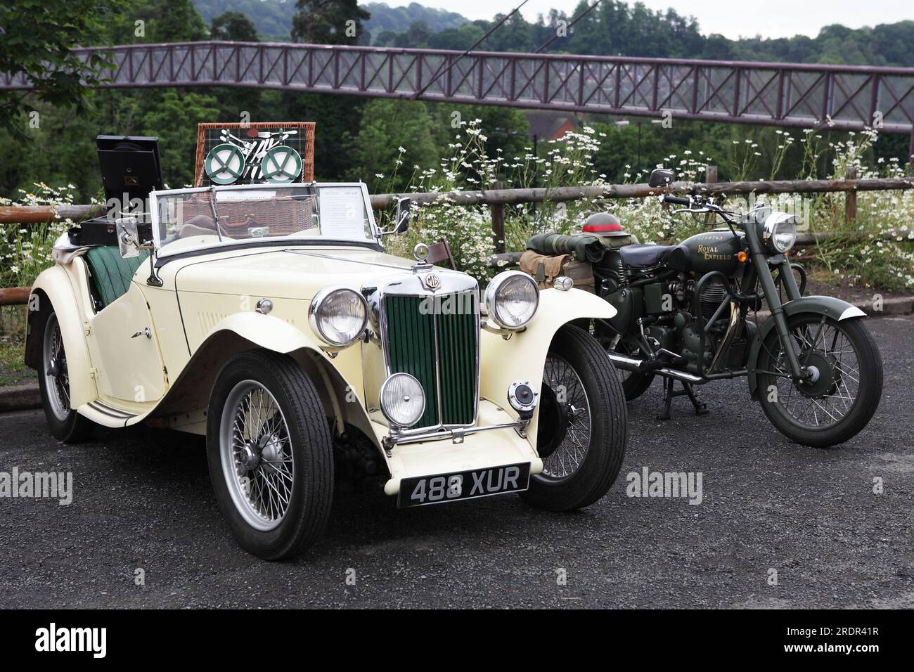 A fine example of an MG TC10 car and a Royal Enfield Motorcycle, seen ...