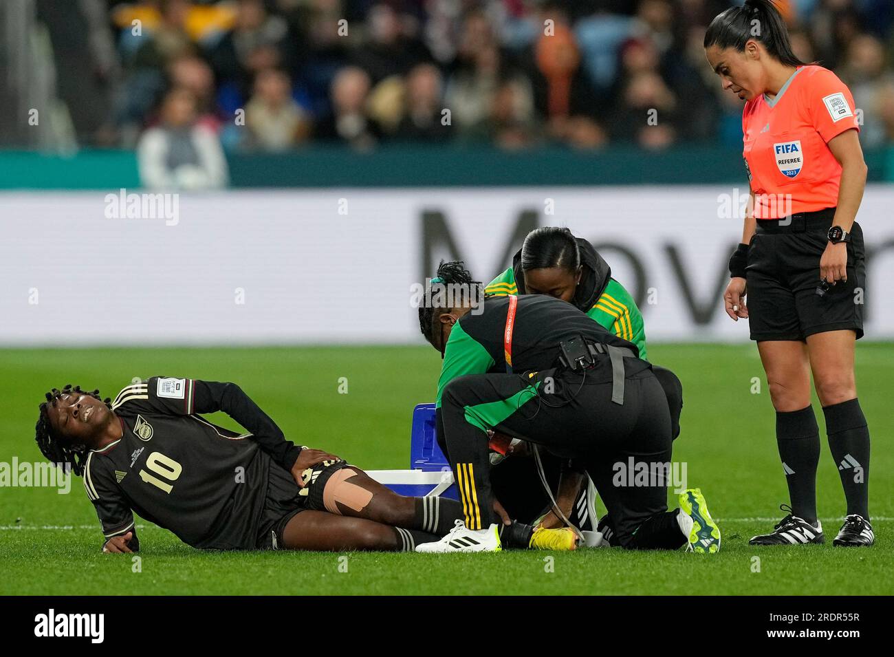 Jamaica's Jody Brown gets treatment after taking a knock during the ...
