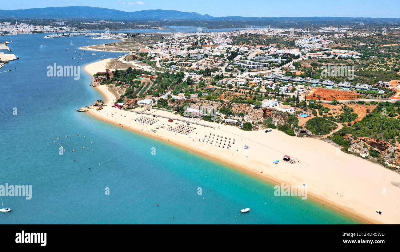 Praia Grande Ferragudo beach looking towards Portimao aerial drone ...
