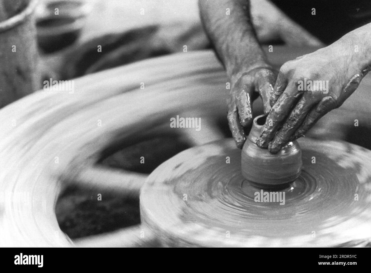 old vintage 1900s black and white picture of Indian potter on potters ...