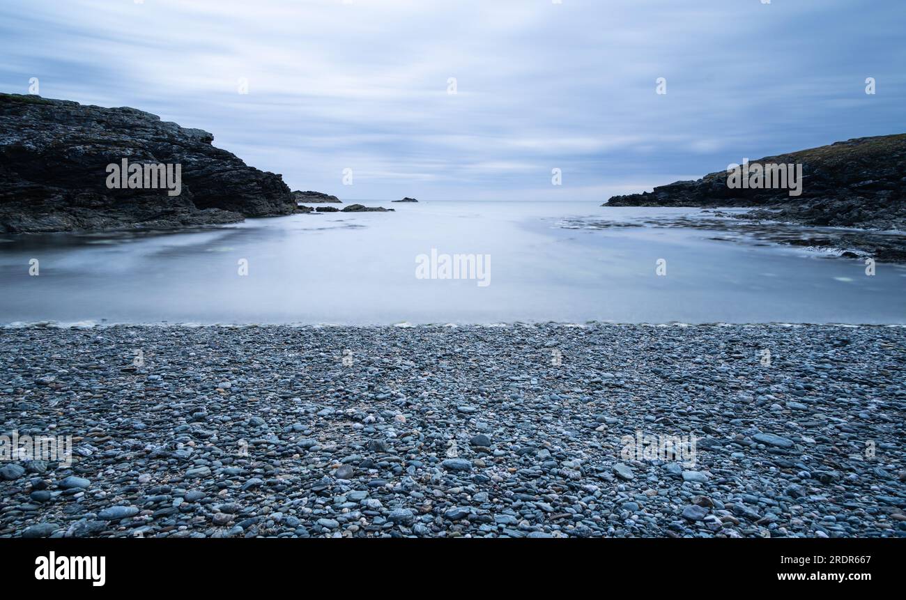 Long exposure. Smooth sea. Pebble beach foreground Stock Photo - Alamy