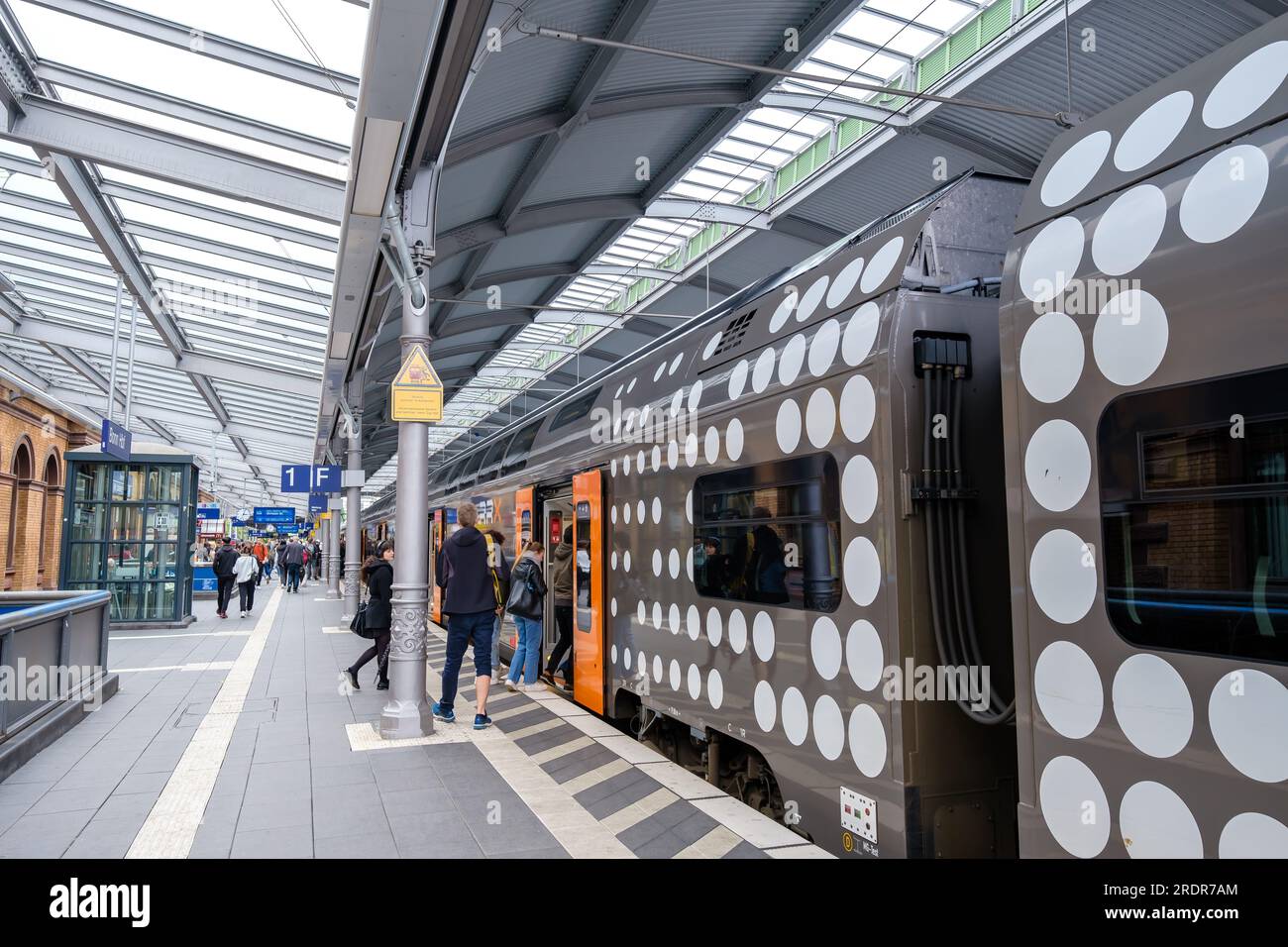 Bonn, Germany - May 22, 2023 : View of people getting on a train at the ...
