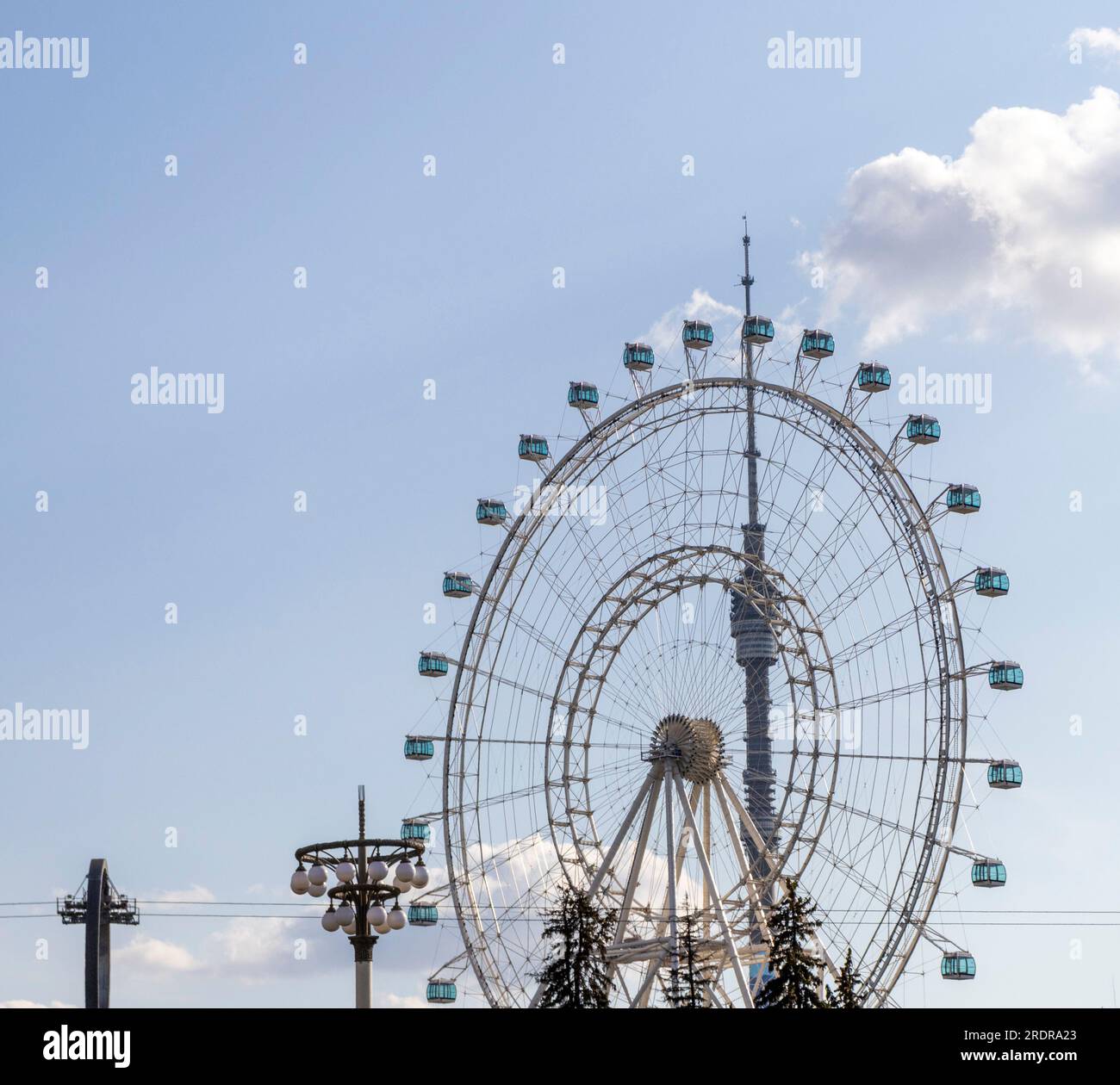 Shot of the television tower and ferris wheel Stock Photo - Alamy