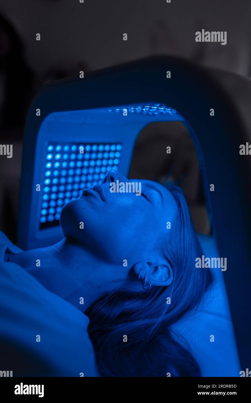 Facial skin care using an LED lamp Stock Photo - Alamy