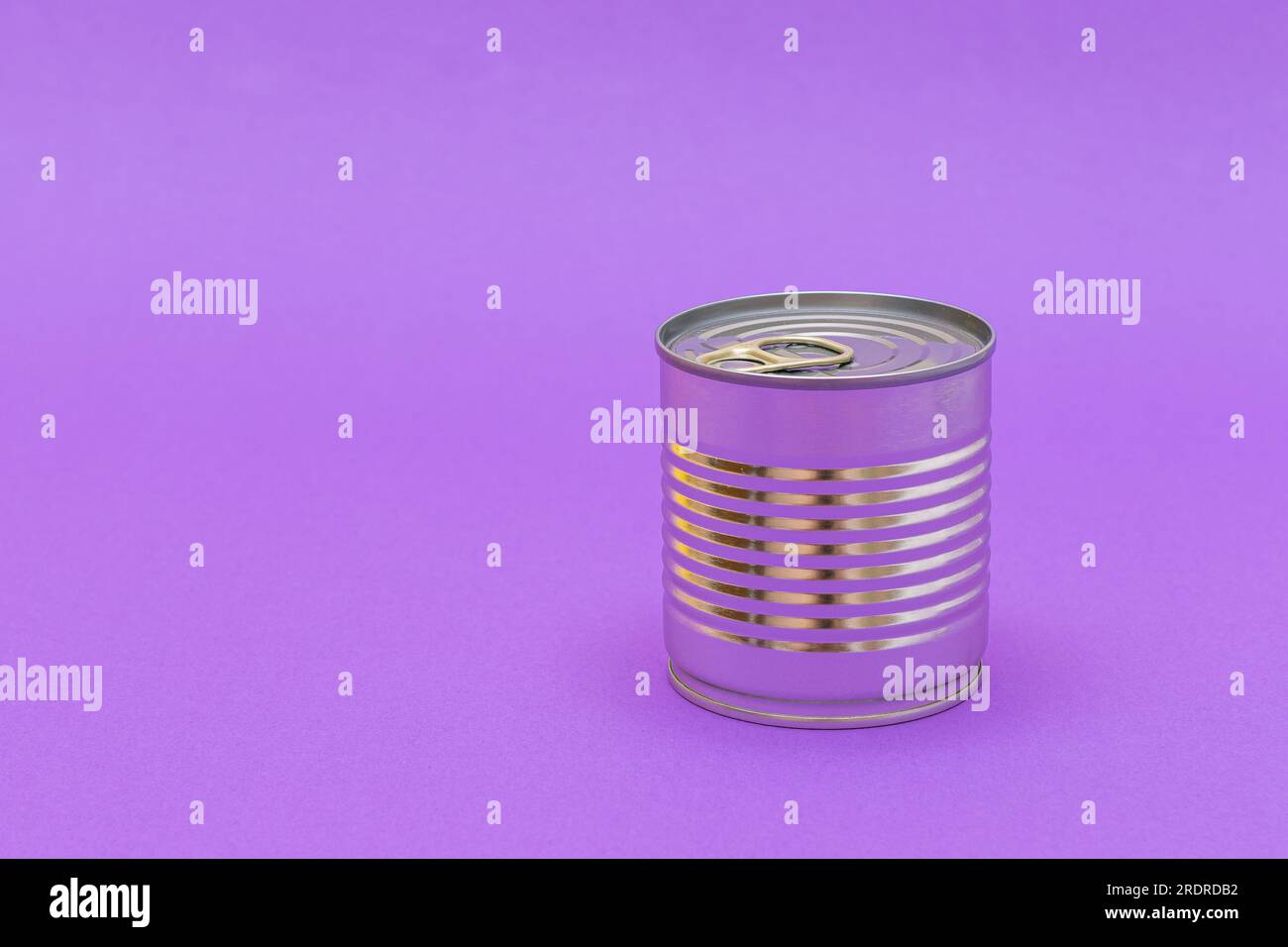 Unopened Tin Can with Blank Edge on Violet Background. Canned Food ...