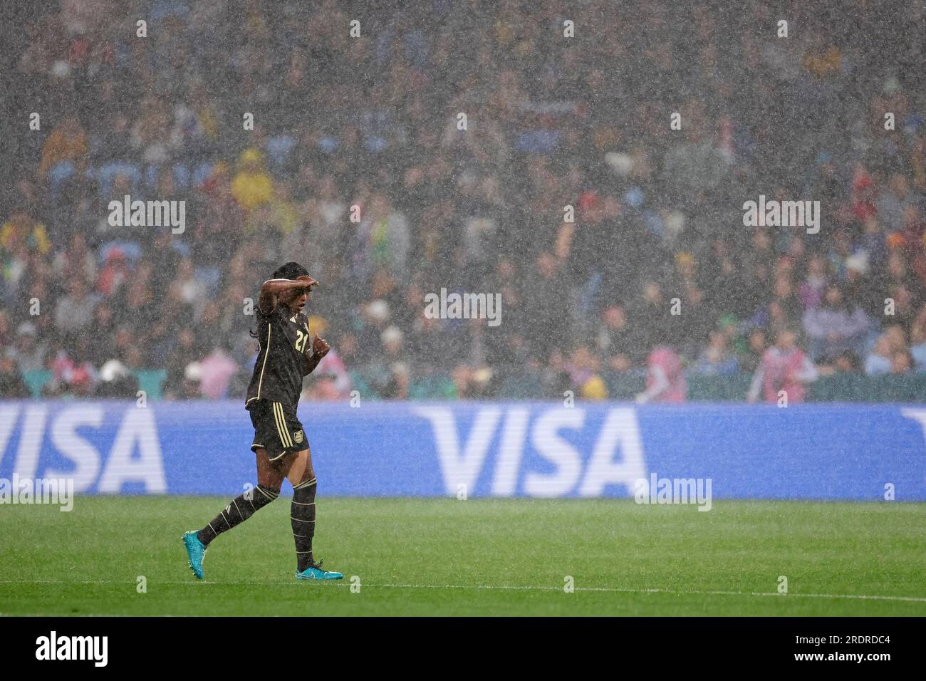 Jamaica's Cheyna Matthews shields her eyes as rain intensifies during ...