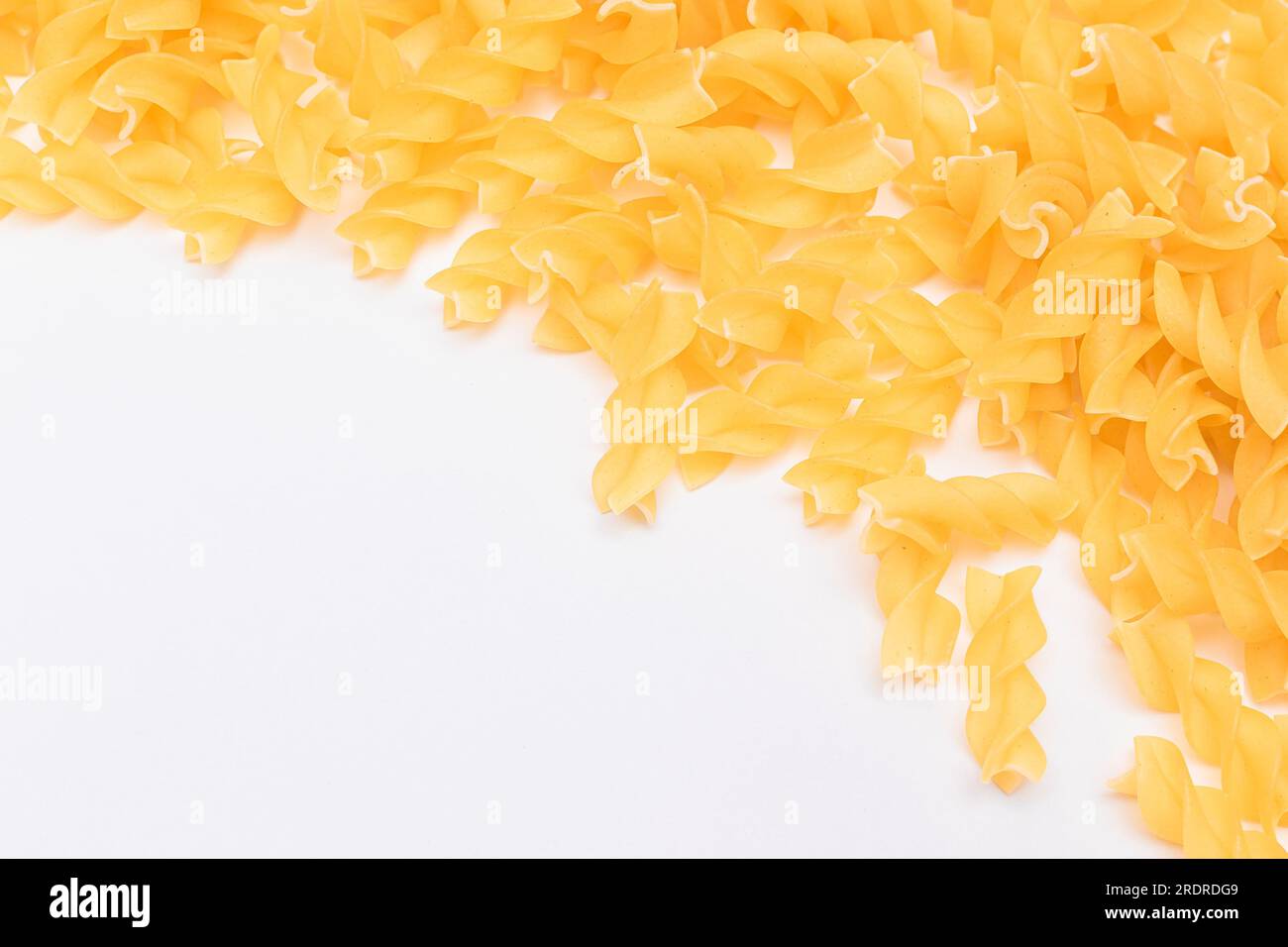Uncooked Fusilli Pasta with Copy Space on White Background. Raw and Dry ...