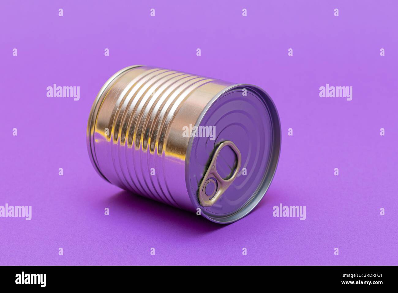 Unopened Tin Can with Blank Edge on Violet Background. Canned Food ...