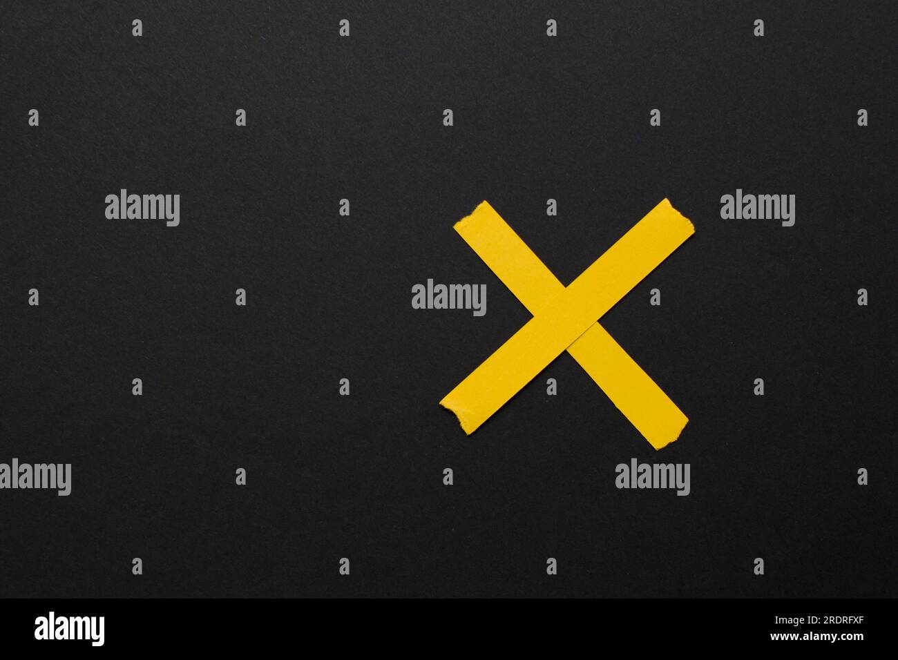 Multiplication yellow sign, symbol on black background Stock Photo - Alamy