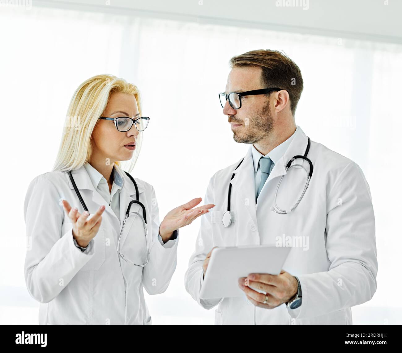 Medical team and discussion and hallway hi-res stock photography and images - Alamy