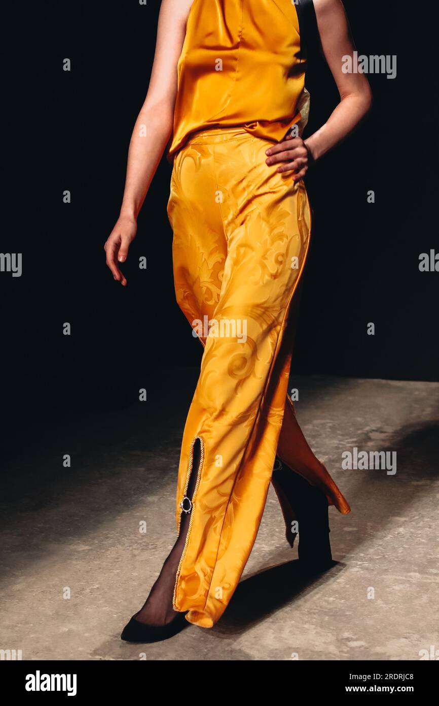 Fashion model woman wearing bright yellow summer costume. Casual ...