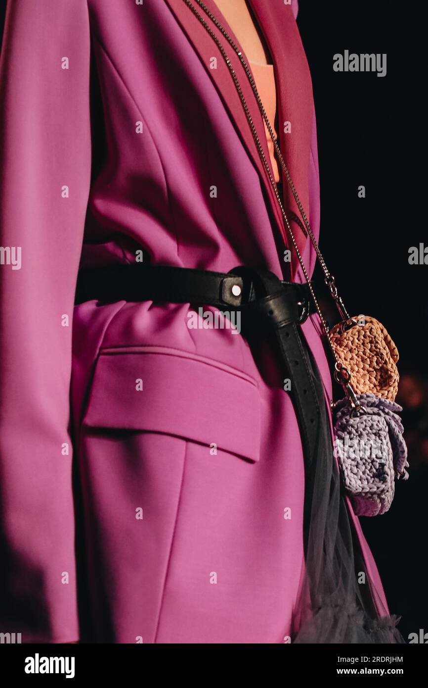 Fashionable details of fancy pink classy jacket on a female figure ...